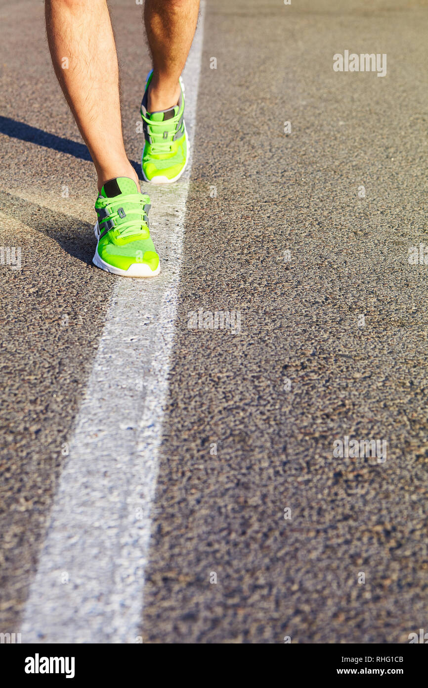 Runner man feet running on road closeup on shoe. Male fitness athlete ...