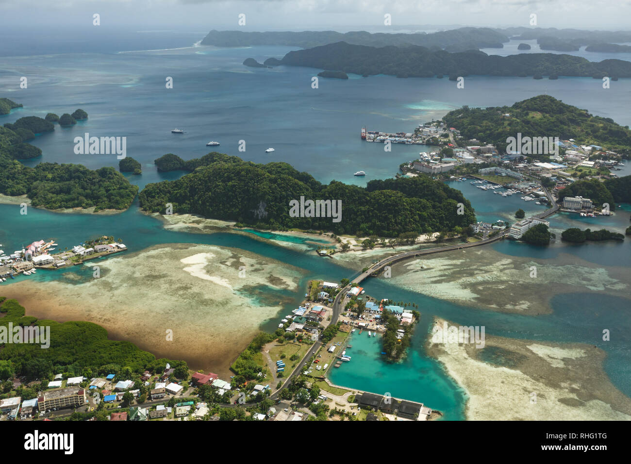 Aerial view of city, bridges and harbor of Koror in a group of islands ...