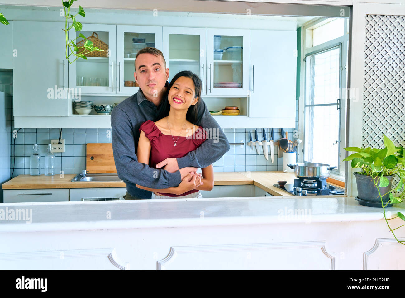 Lovely couple posing - embracing and smiling face of young woman Stock ...