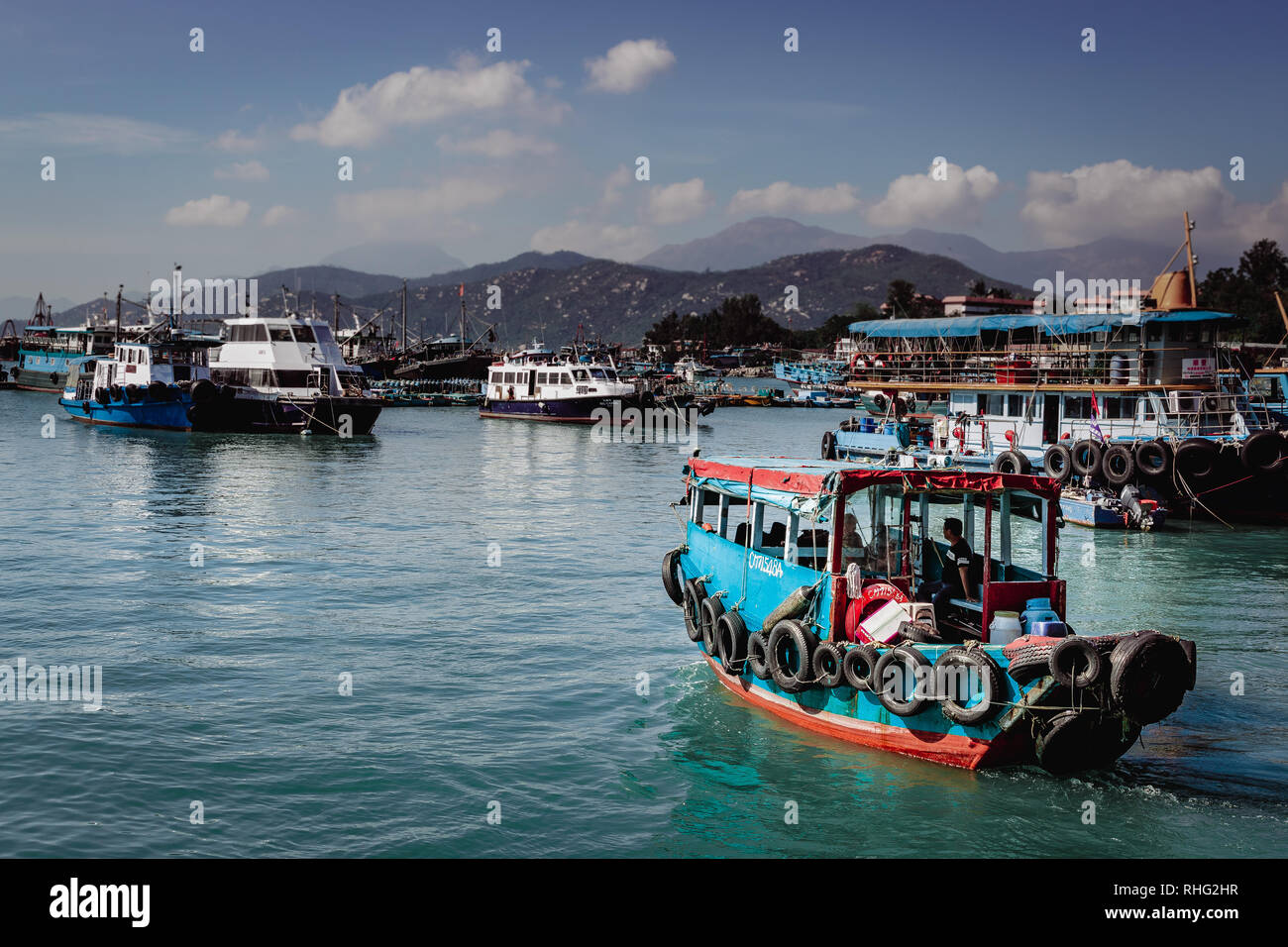 Small fishing ship starting in harbor Stock Photo - Alamy