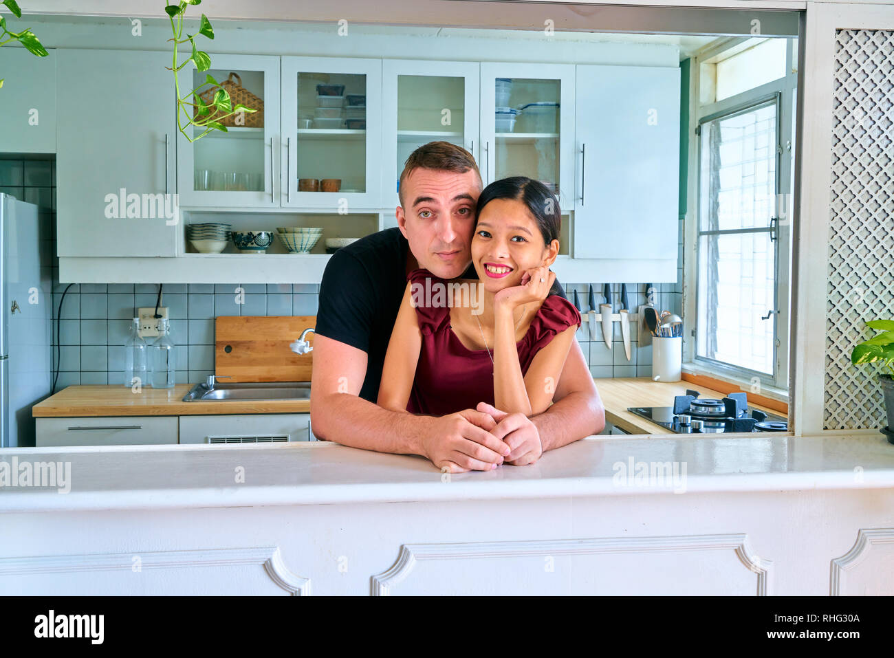 Lovely couple posing - hand on chin with smiling face and hugging Stock ...