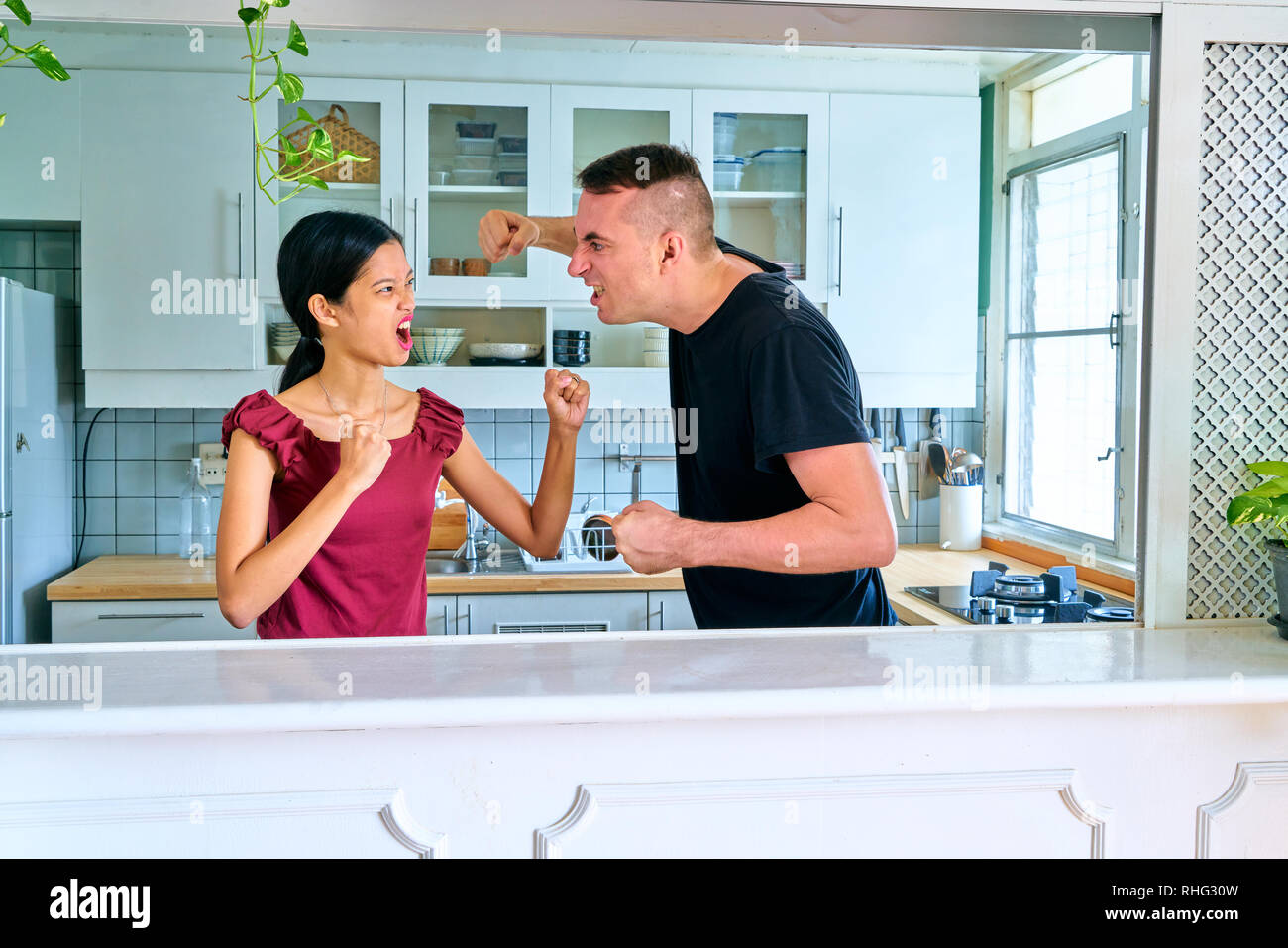 Lovely couple posing - fighting each other Stock Photo - Alamy