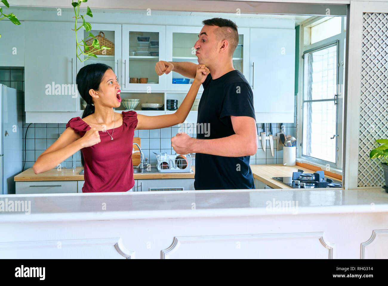 Lovely couple posing - fighting and hitting each other Stock Photo - Alamy