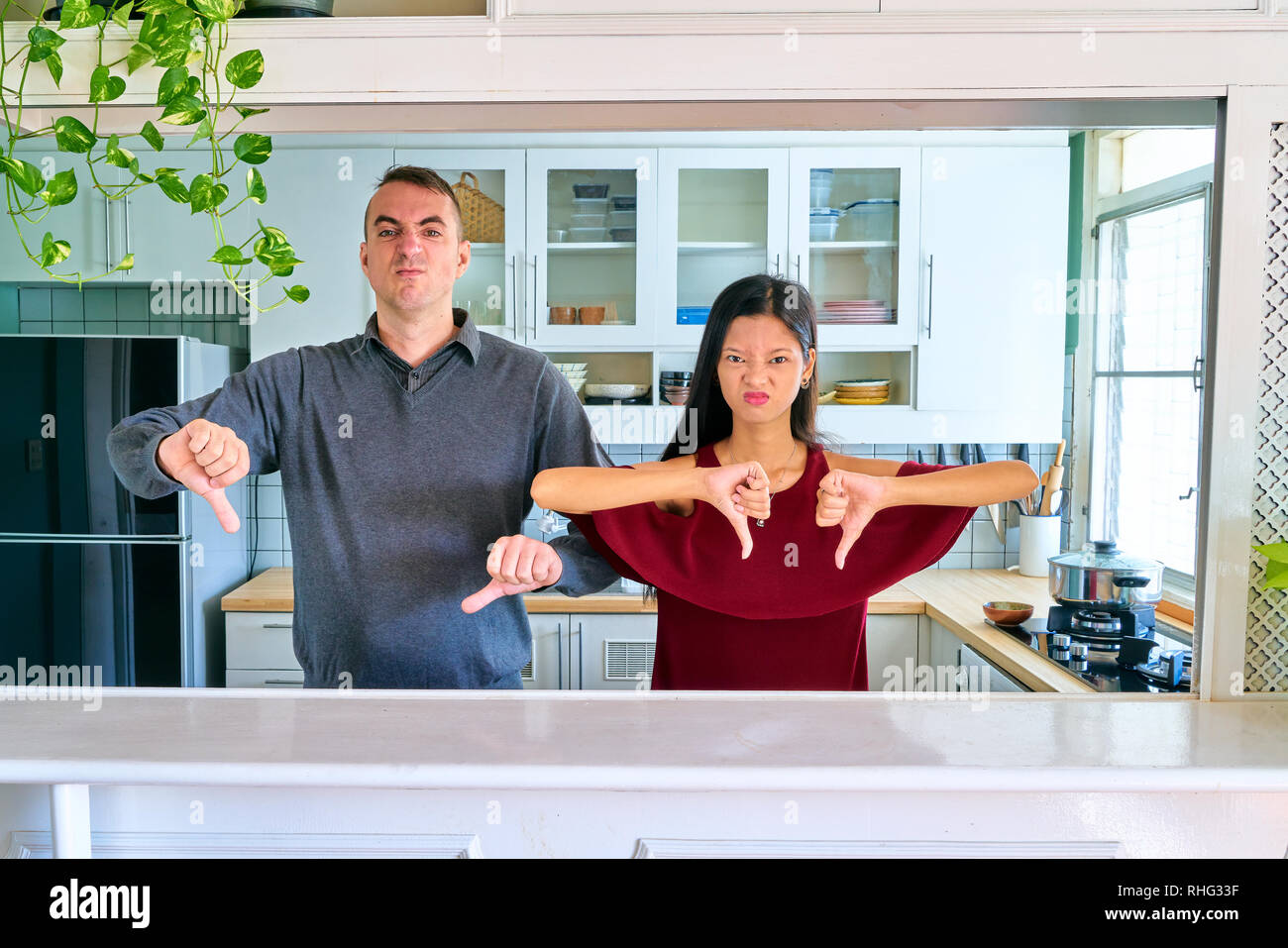 Lovely couple posing - dislike and disappointment Stock Photo - Alamy
