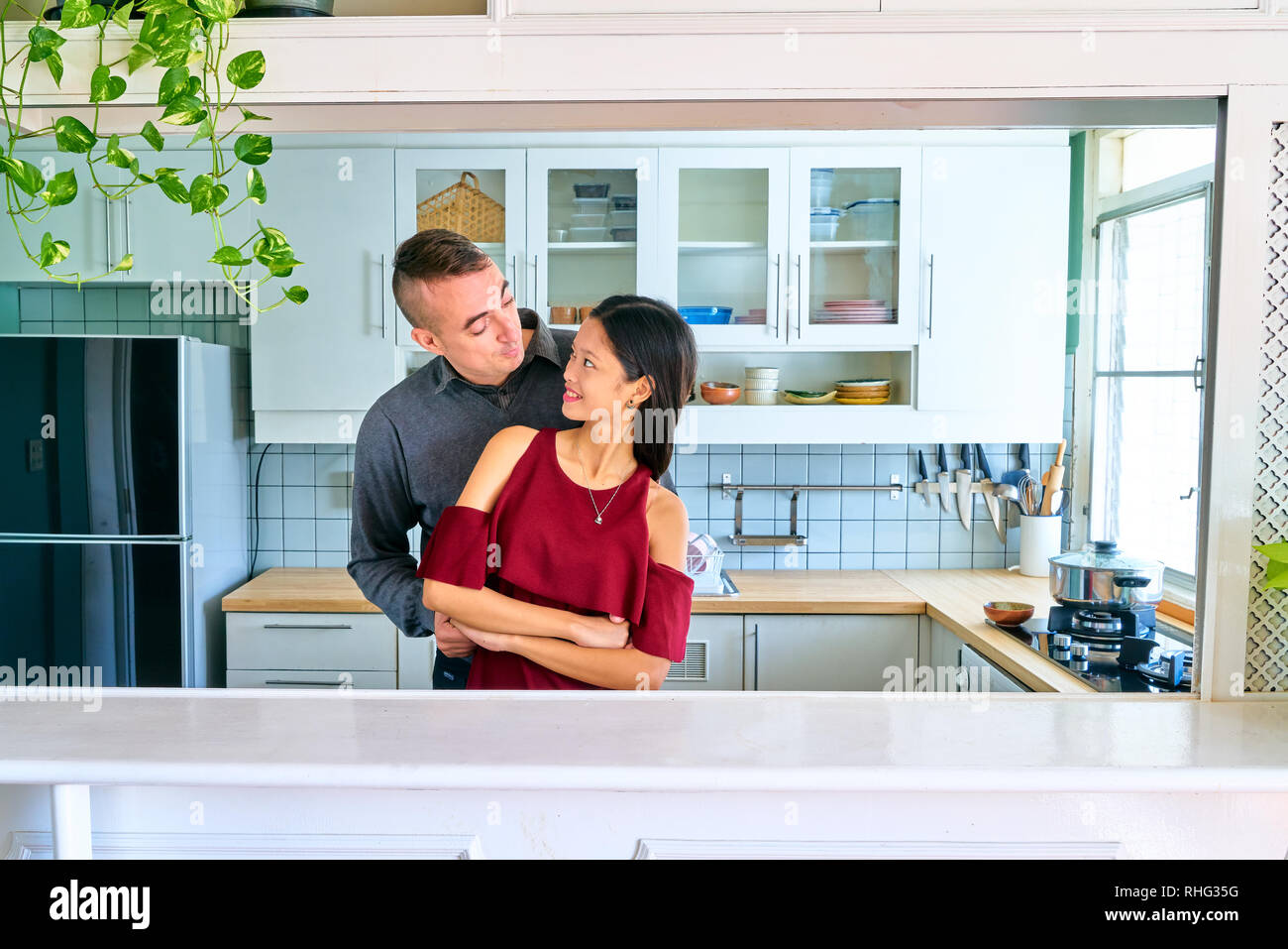 Lovely couple posing - hugging and staring each other Stock Photo - Alamy