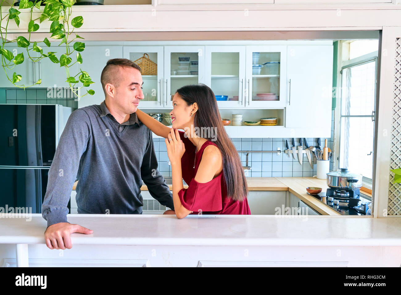 Lovely couple posing - staring and flirting each other Stock Photo - Alamy