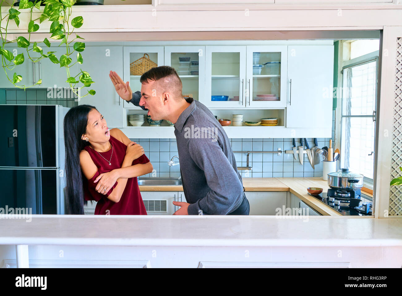 Lovely couple posing - angry man yelling at his young woman Stock Photo ...