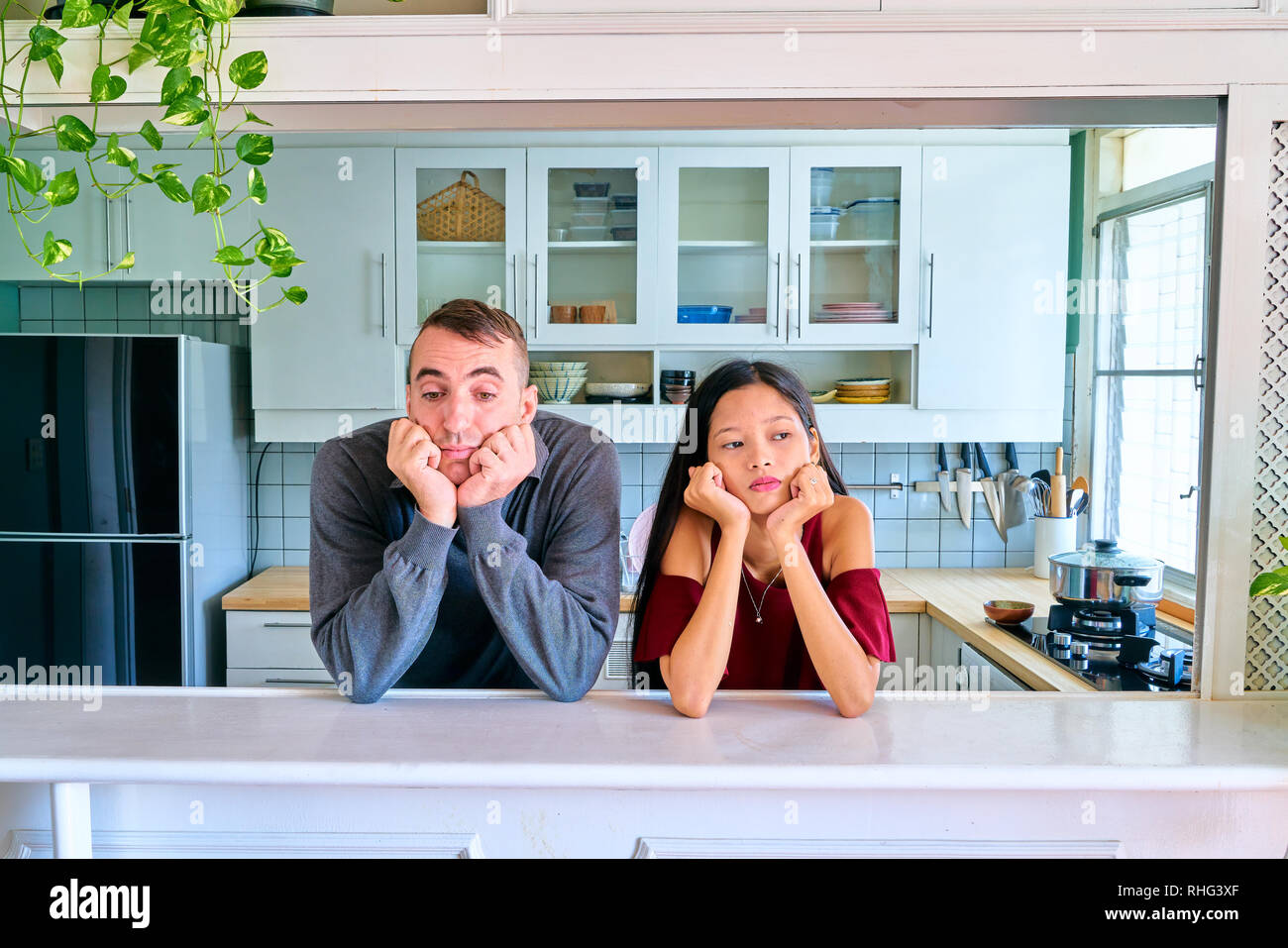 Lovely couple posing - bored and tired Stock Photo - Alamy