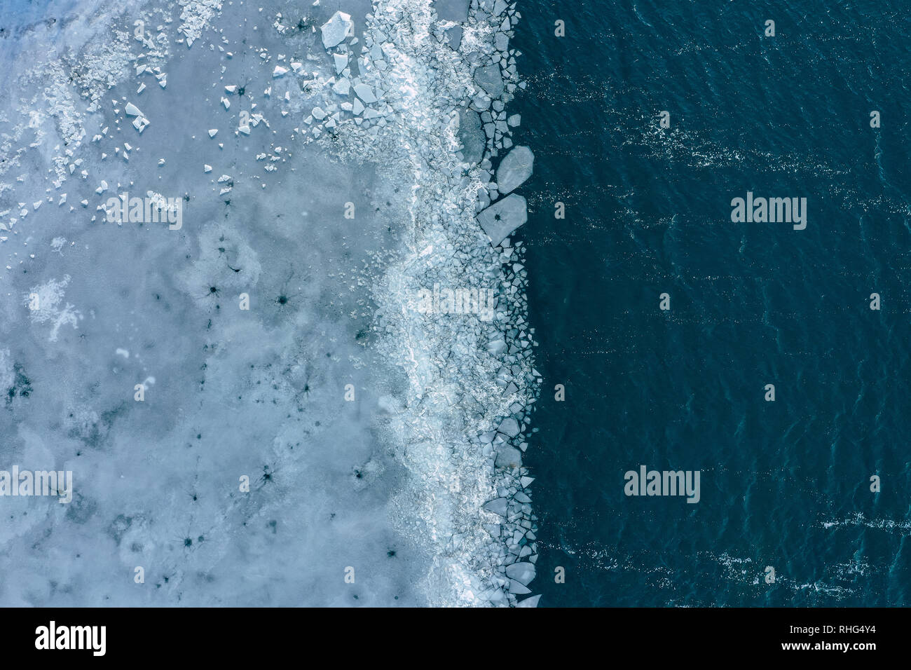 Glacier Lagoon with icebergs from above. Aerial View. Cracked Ice from ...