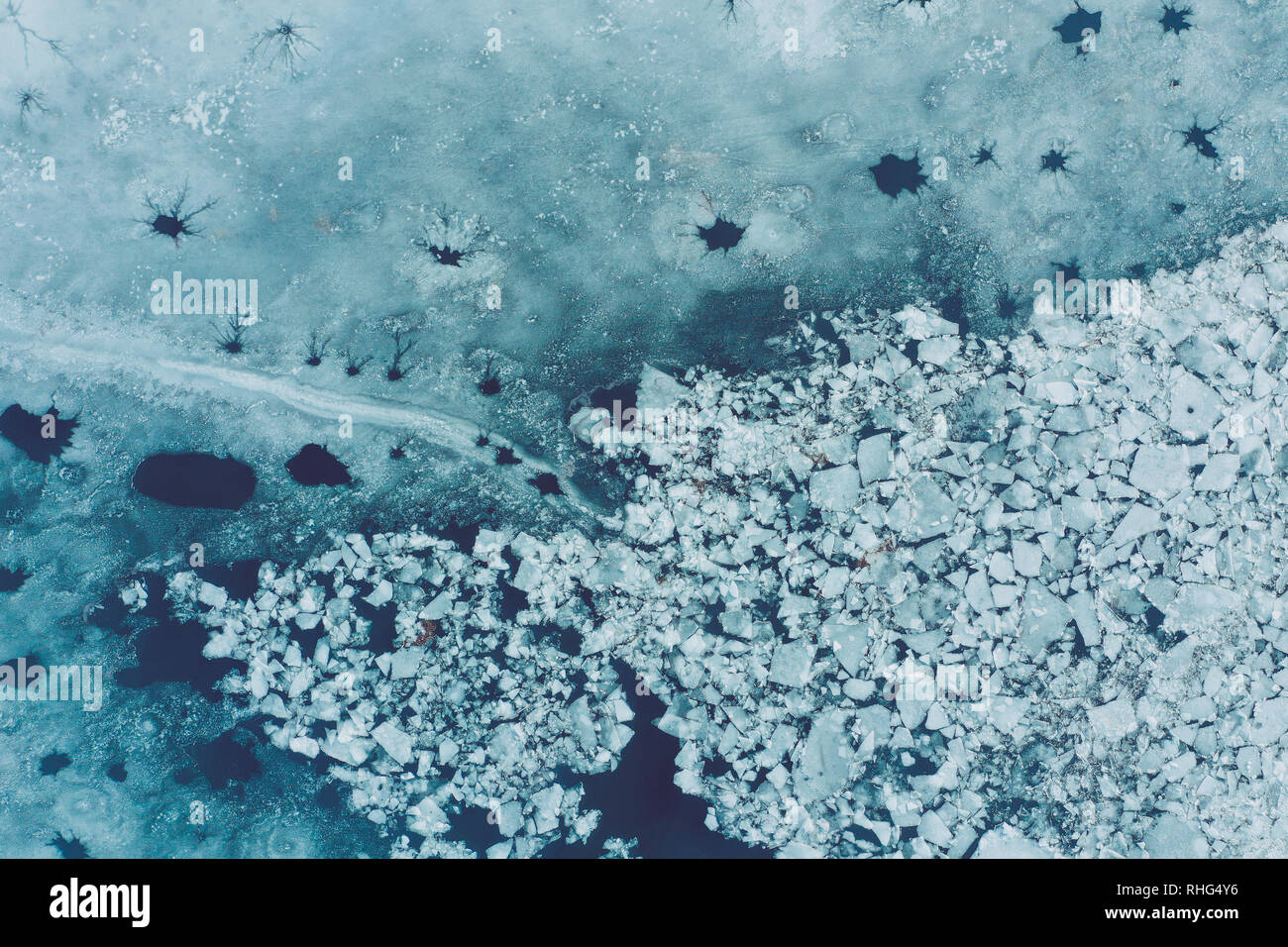 Glacier Lagoon with icebergs from above. Aerial View. Cracked Ice from ...