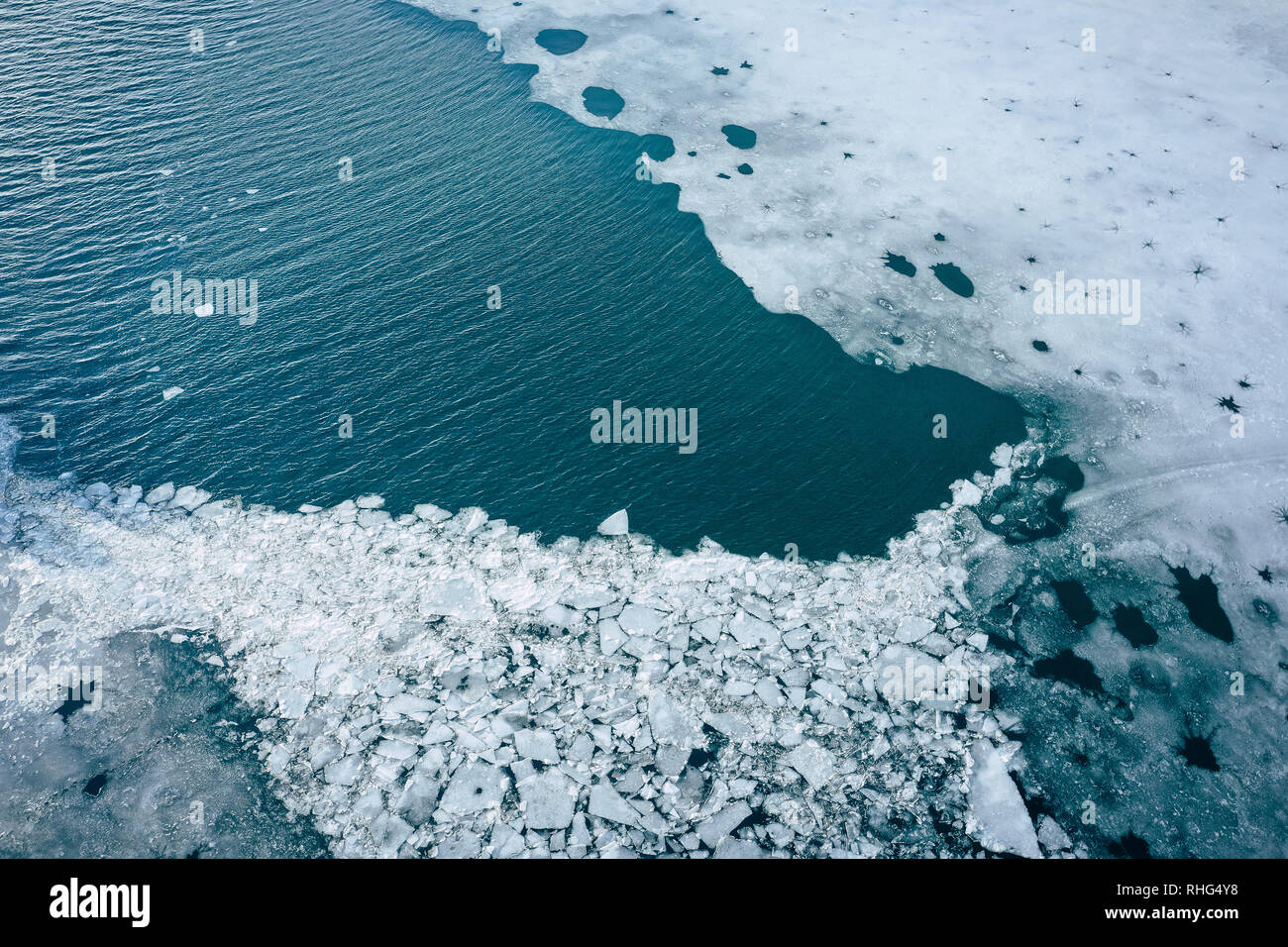 Glacier Lagoon with icebergs from above. Aerial View. Cracked Ice from ...