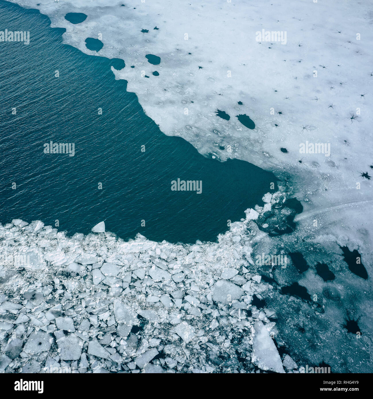 Glacier Lagoon with icebergs from above. Aerial View. Cracked Ice from ...
