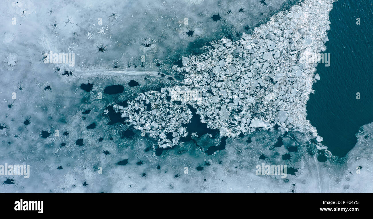 Glacier Lagoon with icebergs from above. Aerial View. Cracked Ice from ...