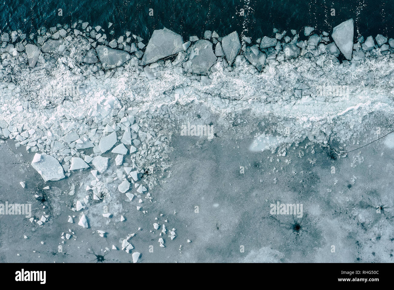 Glacier Lagoon with icebergs from above. Aerial View. Cracked Ice from ...