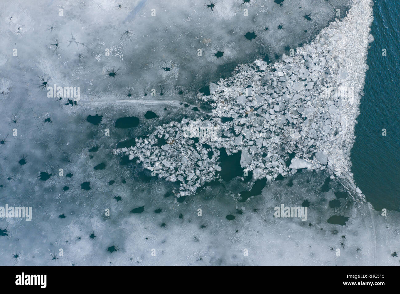 Glacier Lagoon with icebergs from above. Aerial View. Cracked Ice from ...