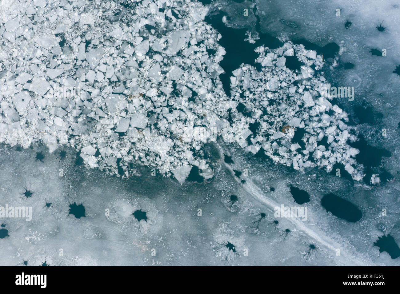 Glacier Lagoon with icebergs from above. Aerial View. Cracked Ice from ...