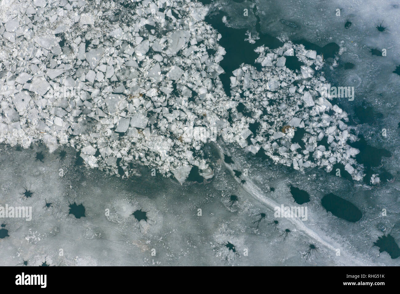 Glacier Lagoon with icebergs from above. Aerial View. Cracked Ice from ...