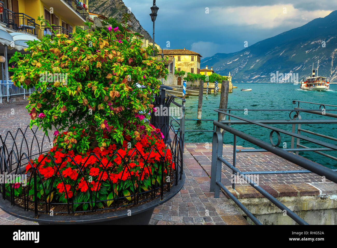 Beautiful paved walkway and harbor decorated with colorful ...