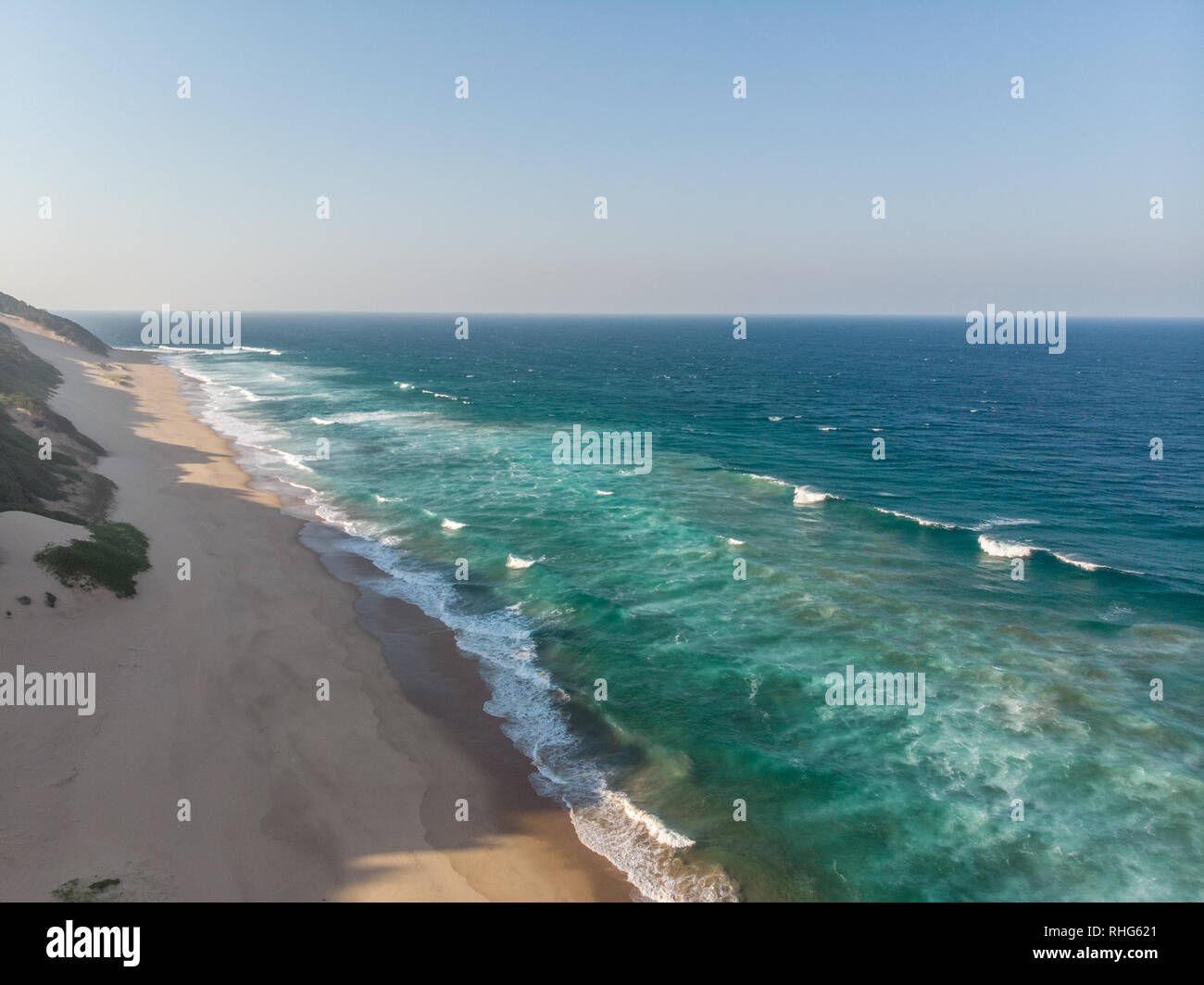 Aerial view of clear blue Indian ocean beach in Ponta do Ouro ...