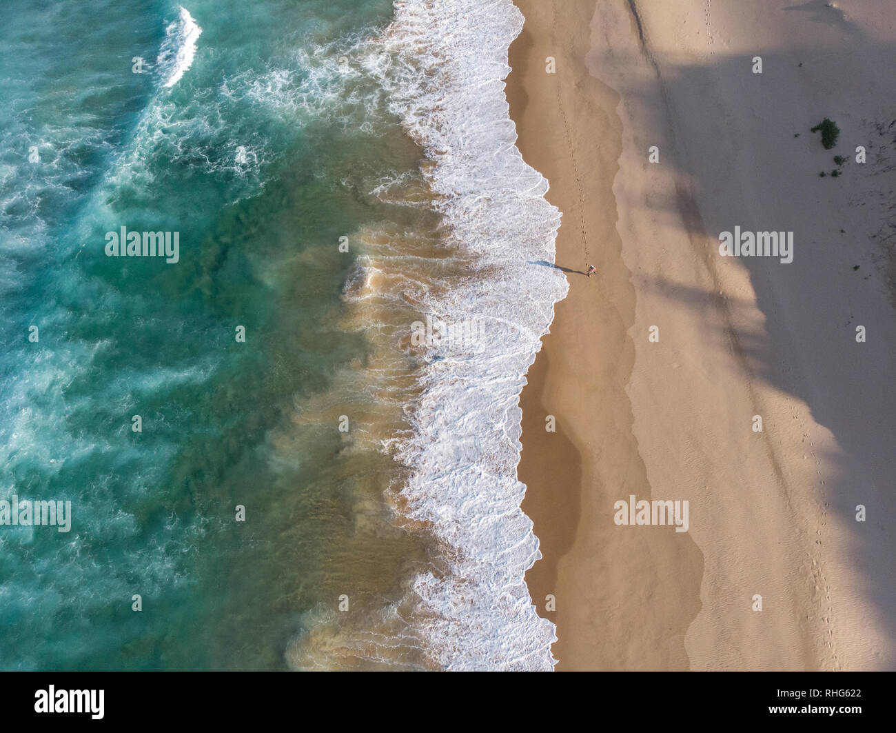 Aerial view of clear blue Indian ocean beach in Ponta do Ouro ...