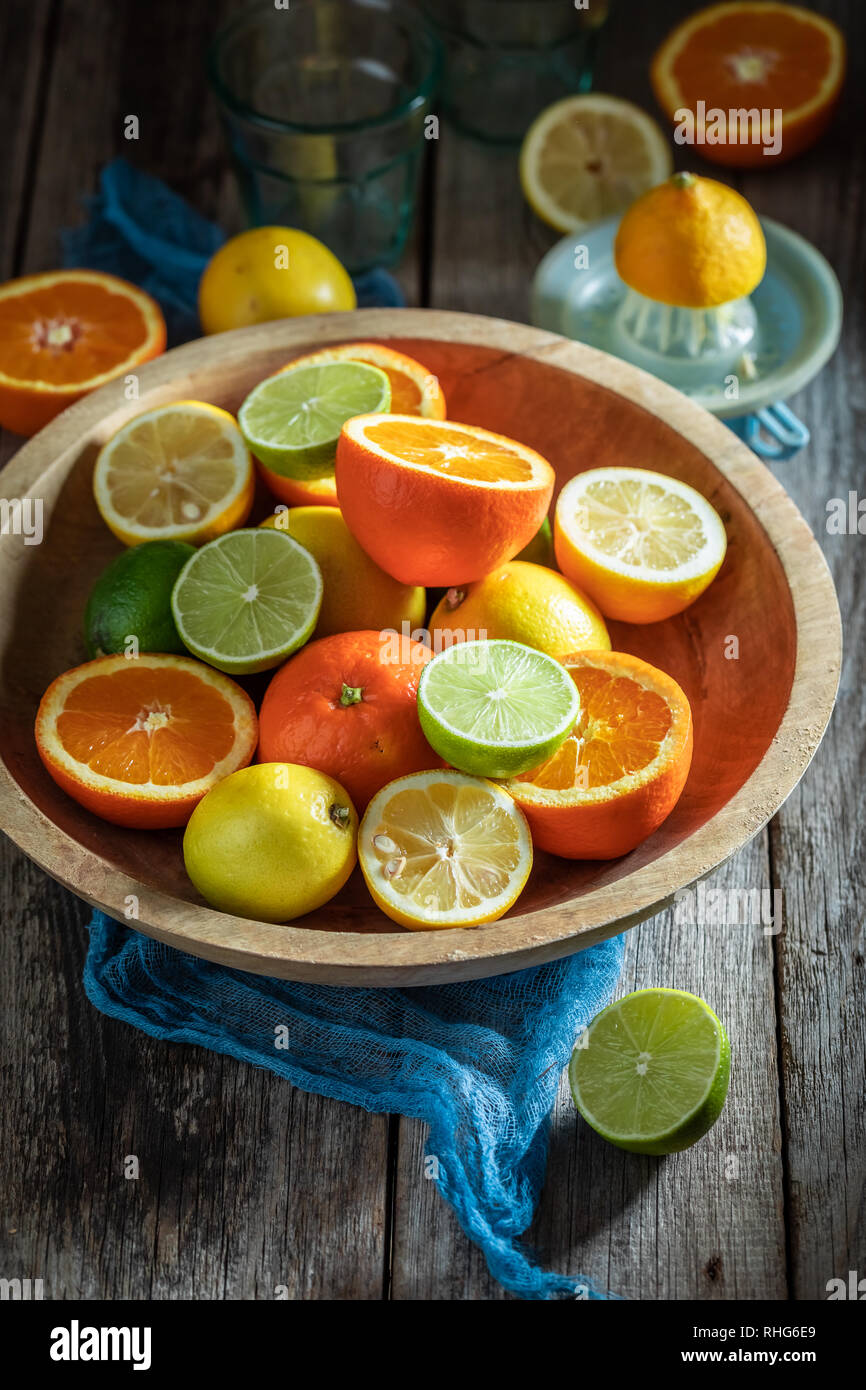 Healthy mix of citrus fruits with on rustic table Stock Photo - Alamy
