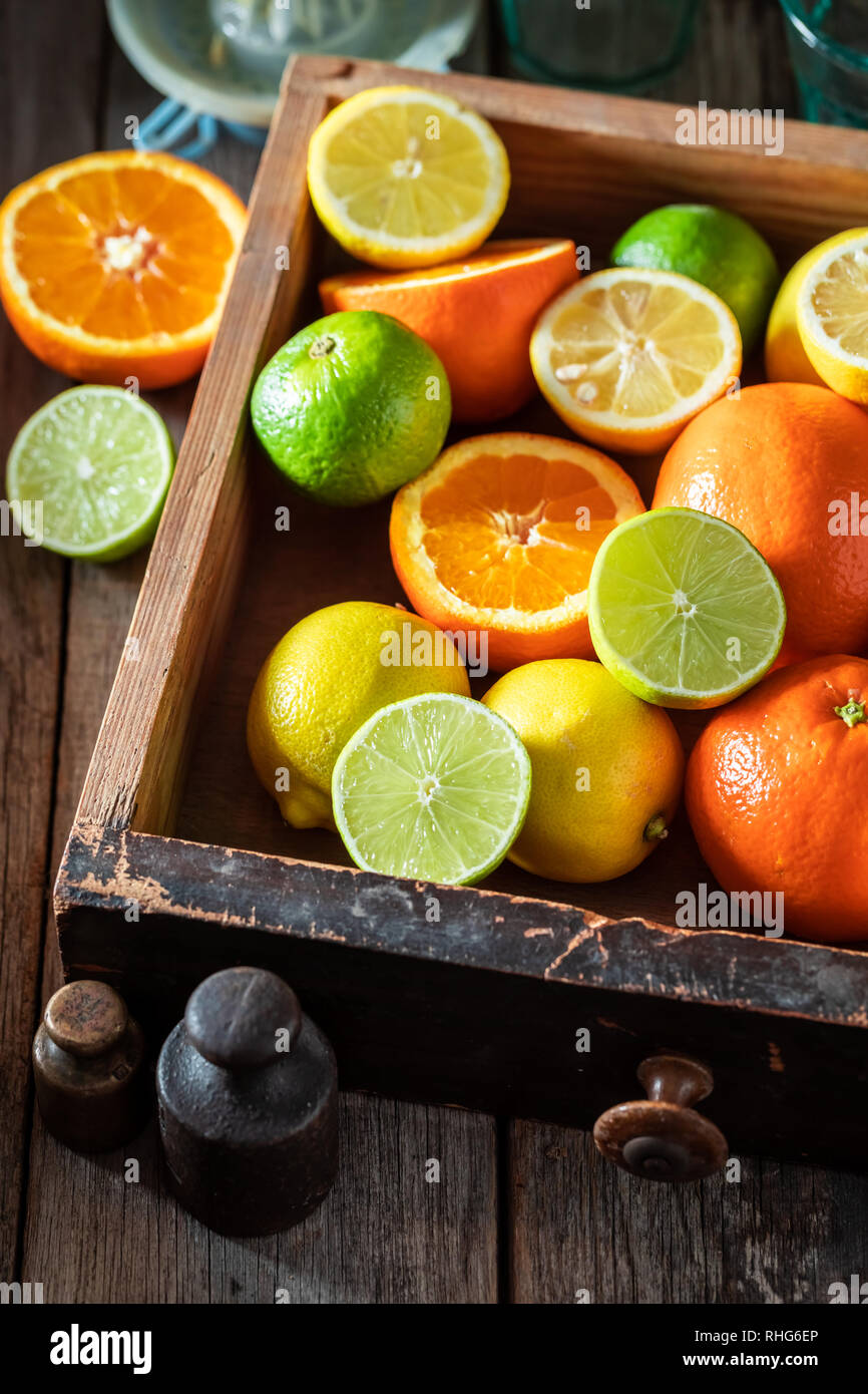 Sweet mix of citrus fruits with on rustic table Stock Photo - Alamy