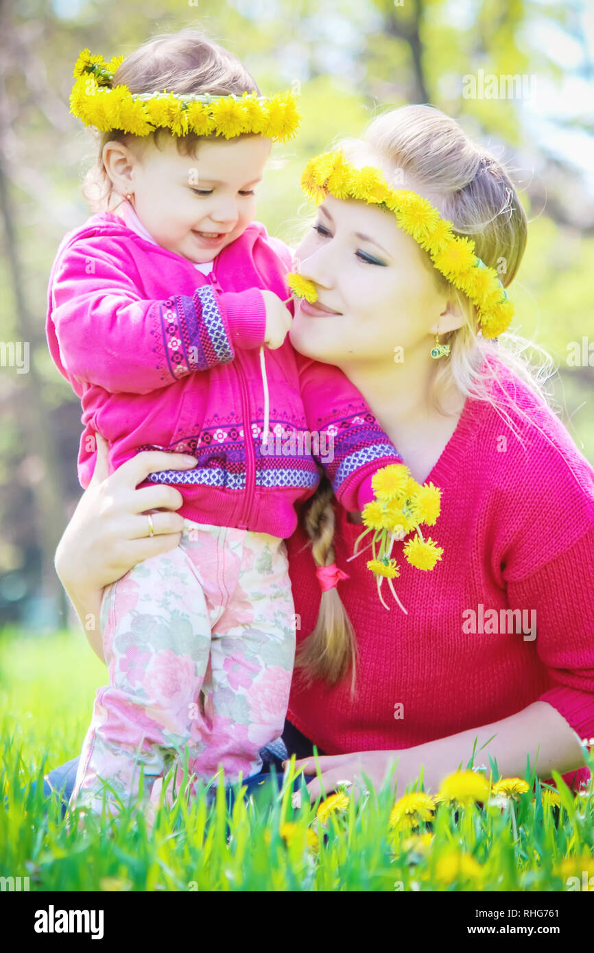 Girl, child, flowers in the spring plays. Selective focus Stock Photo ...