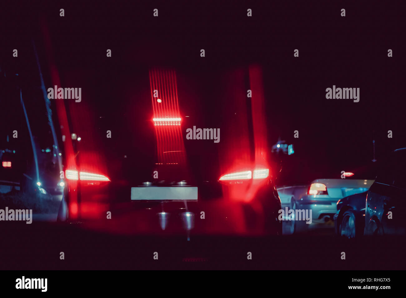 The traffic jam on the road in the city at the night with yellow and ...