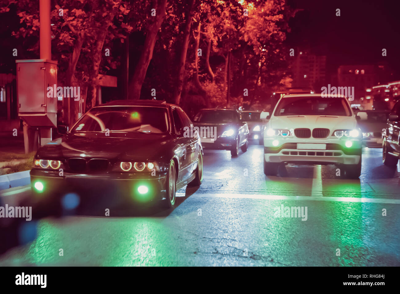 Night view of the cars. Road in the city at the night with yellow and ...