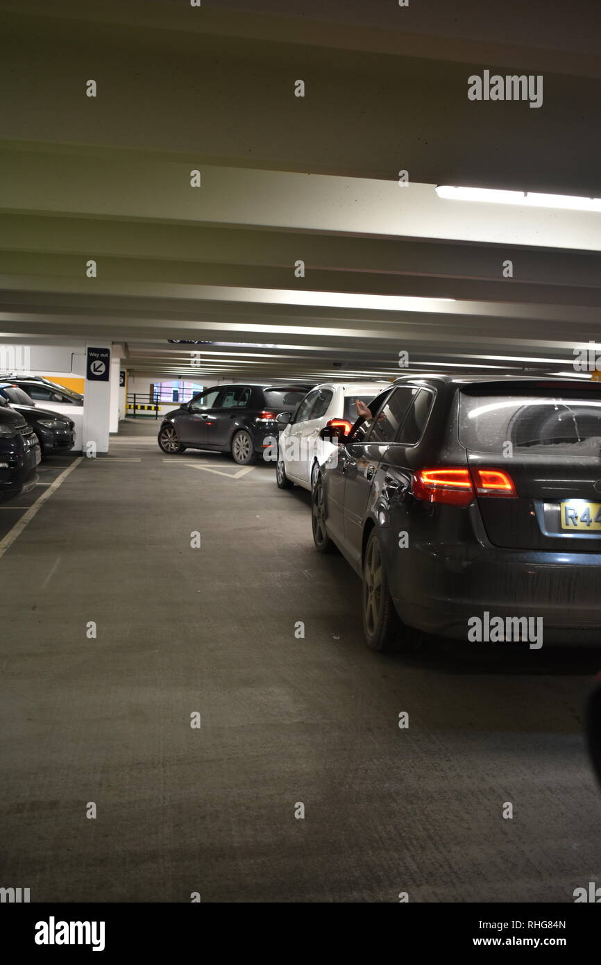 Cars queueing in a car park Stock Photo - Alamy