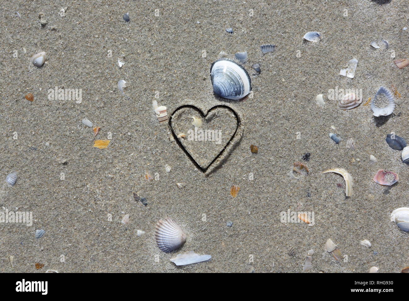 Heart on the sand beach Stock Photo - Alamy