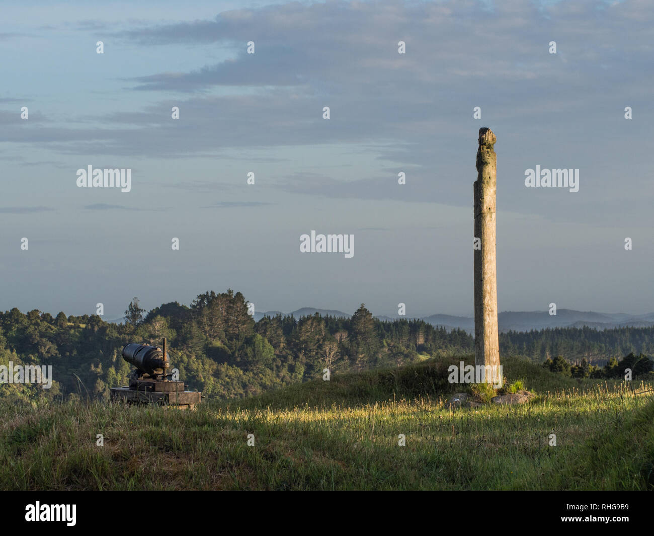 Pou whenua carved wooden post, and broken cannon, mounds and hollows ...