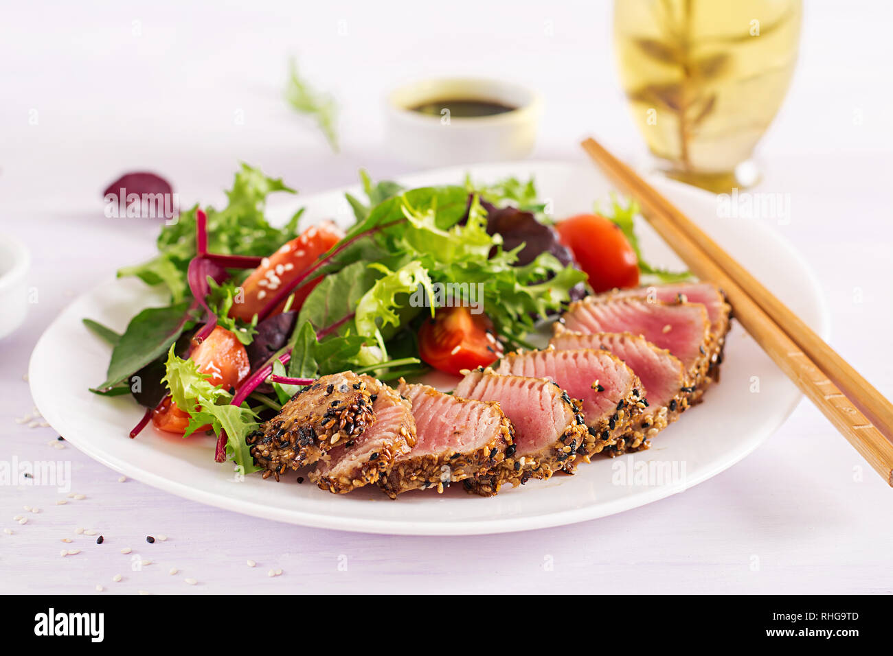 Japanese traditional salad with pieces of medium-rare grilled Ahi tuna ...