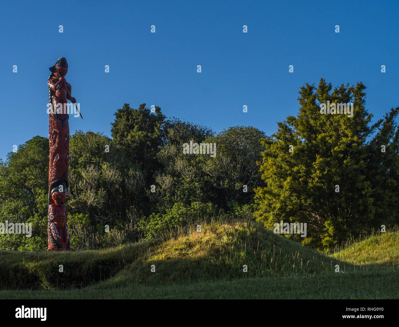 Pou whenua carved wooden post, mounds and hollows remains of ...