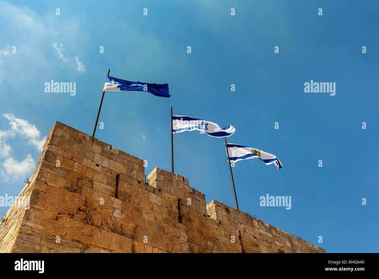 Flags of Israel and of Jerusalem waving on top of the Citadel walls ...
