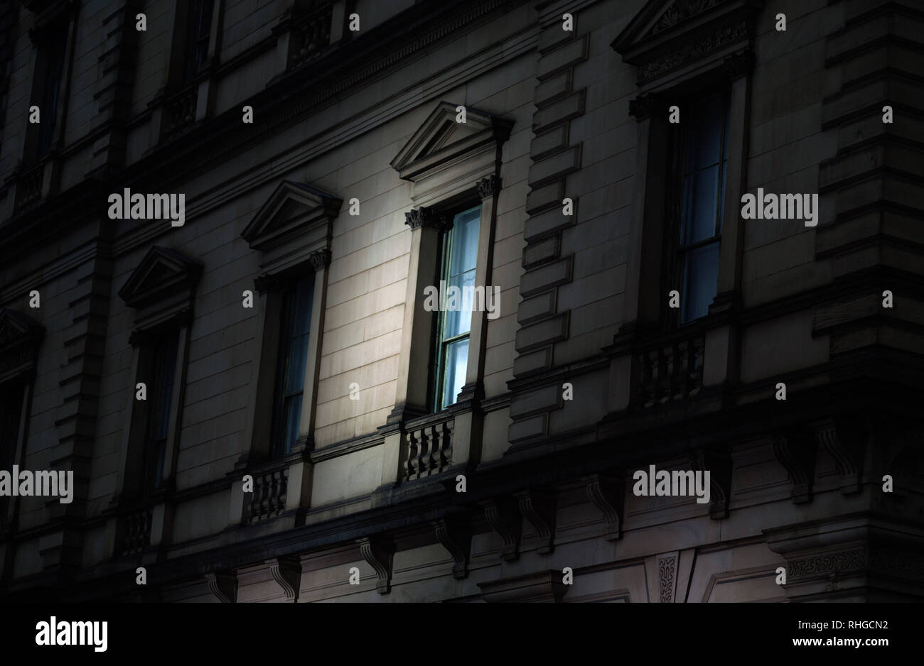 Spotlight on Exterior Window at Night Stock Photo - Alamy