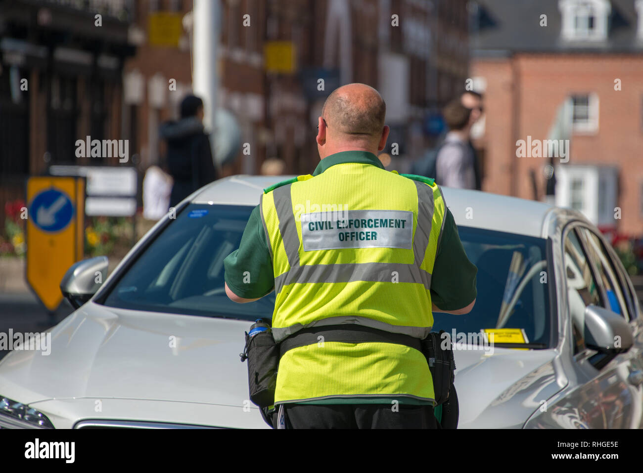 traffic warden civil enforcement officer wearing reflective yellow vest ...