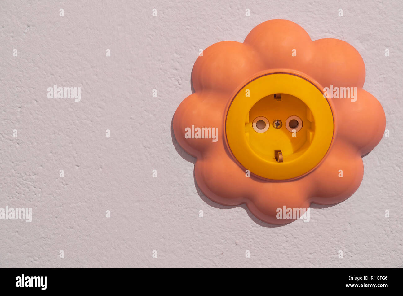 Socket in the shape of flowers on the wall of a children's room to a ...