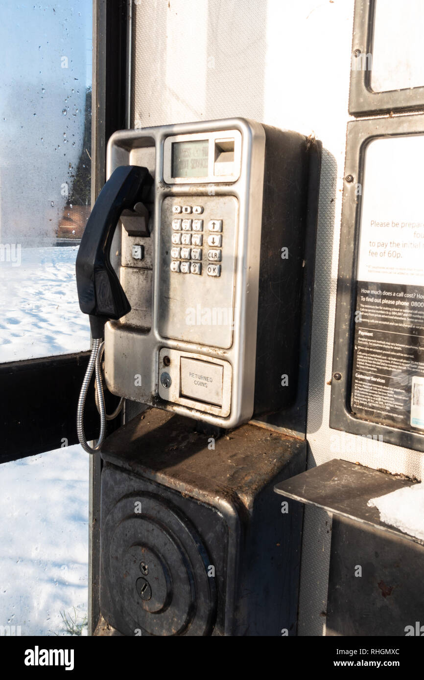A close up of a telephone in a public phone box Stock Photo - Alamy