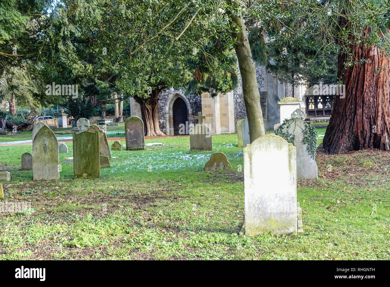 Old gravestones in a churchyard mark thew final resting places of ...