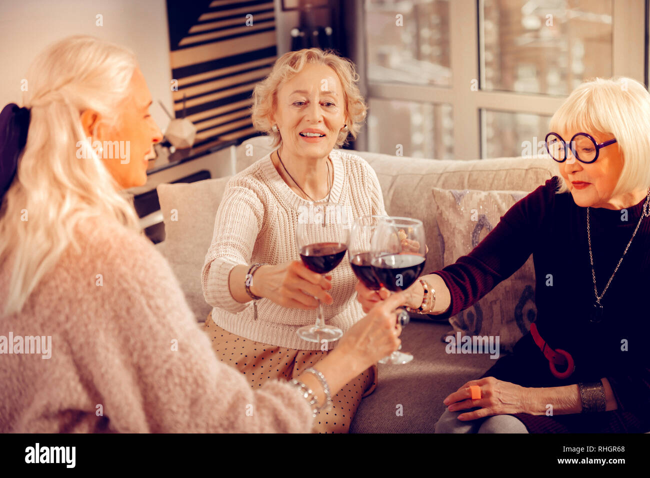 Delighted joyful senior women celebrating their reunion Stock Photo - Alamy