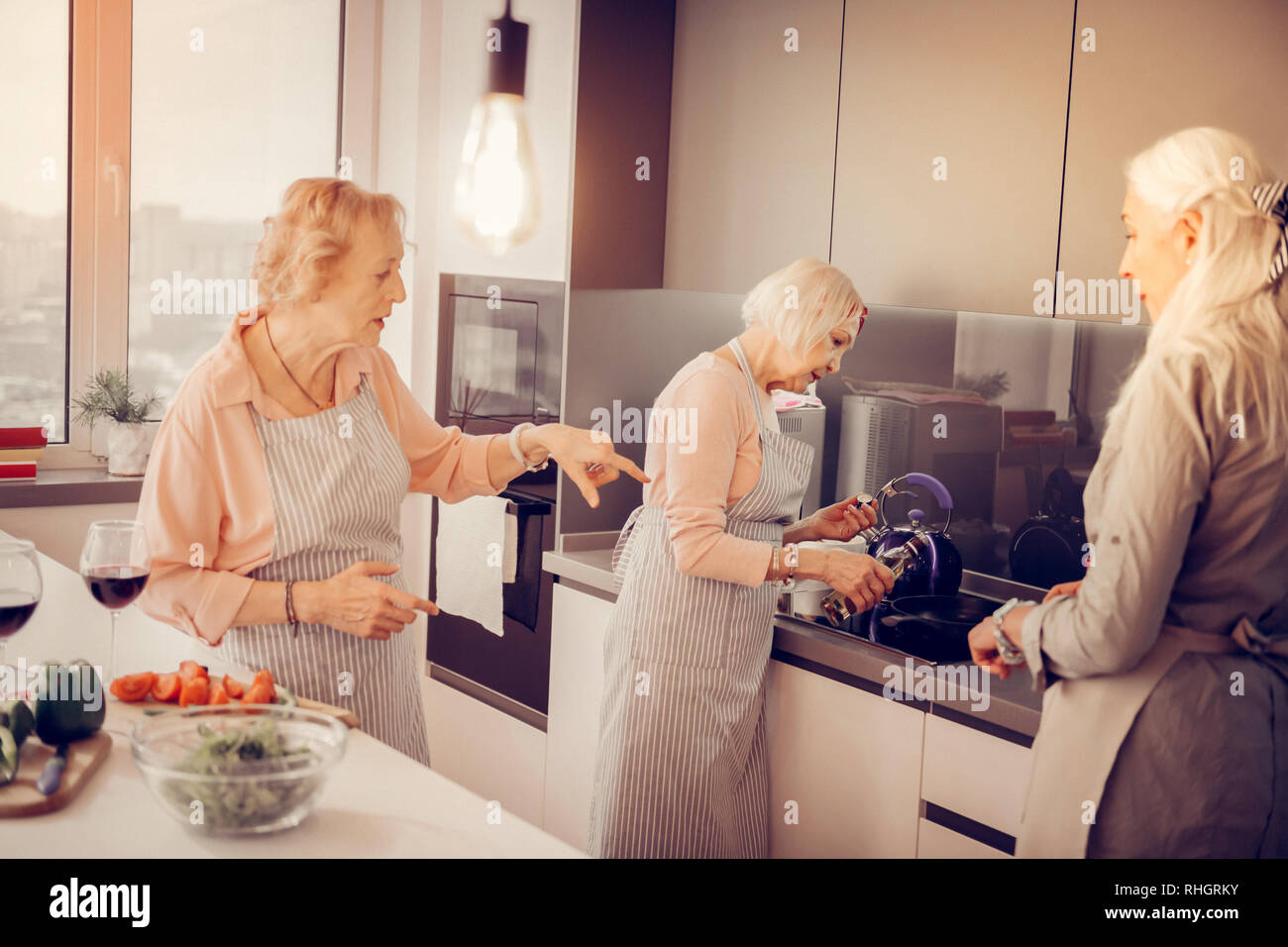 Nice senior woman giving a piece of advice Stock Photo - Alamy