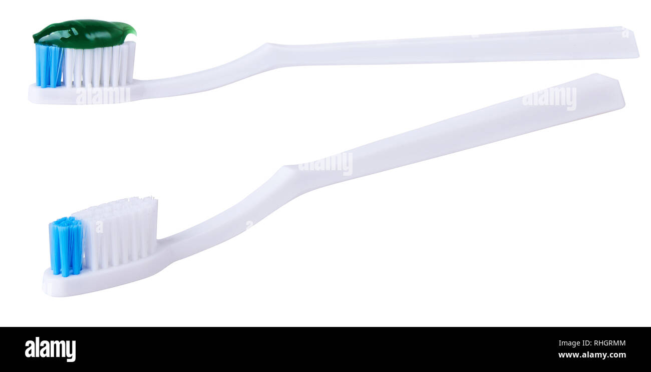 White toothbrush with green gel toothpaste isolated on white background ...