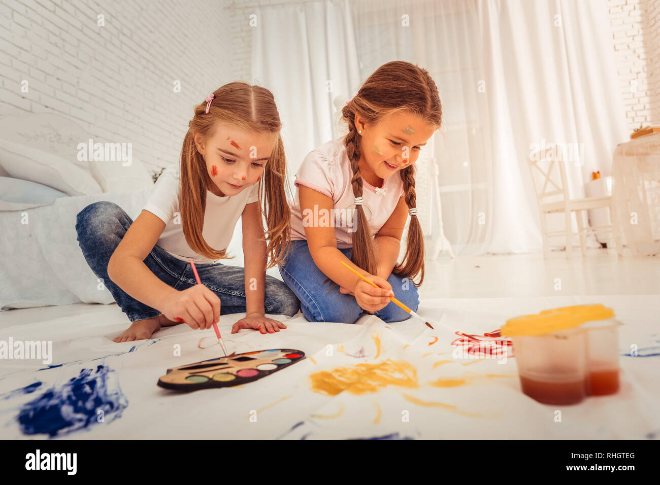 Positive nice girls having a creative hobby Stock Photo - Alamy