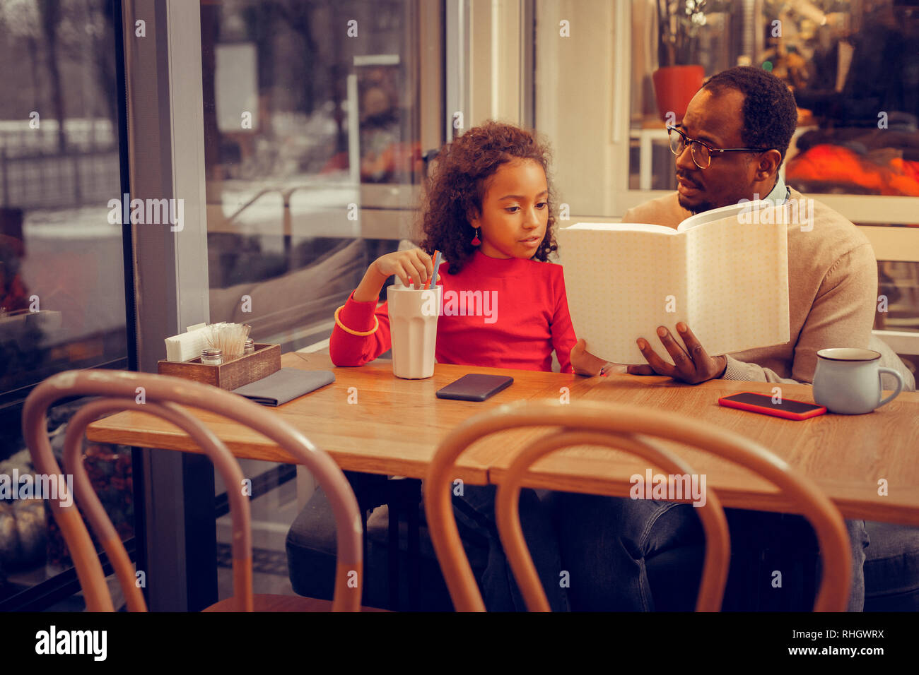 Caring loving father reading book for his cute little girl Stock Photo ...