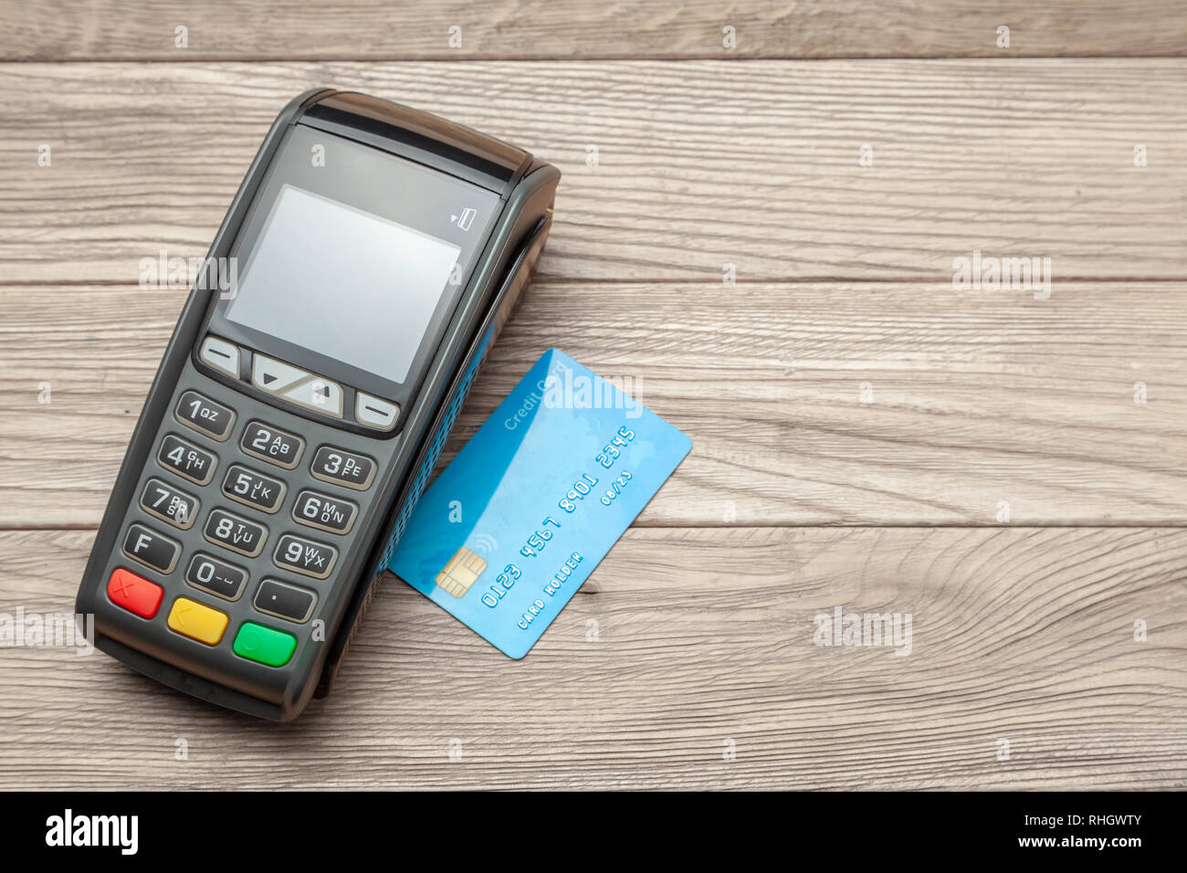 POS terminal, Payment Machine credit card on wooden background ...