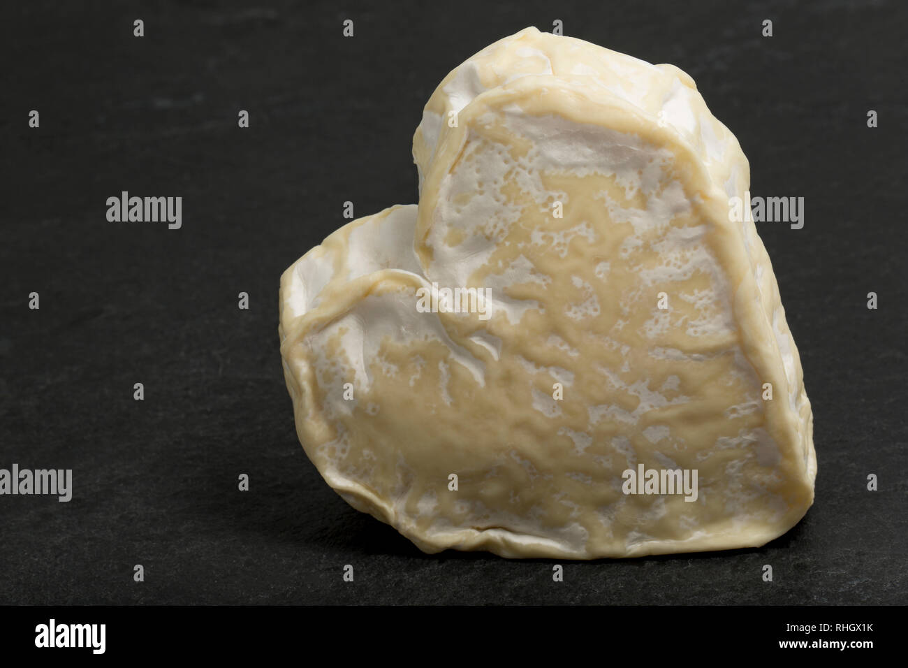 A heart-shaped Neufchatel cheese, from Normandy, France made from cows ...