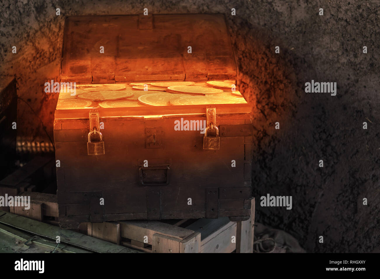 Modern pirate treasure chest filled with golden glowing bitcoins ...