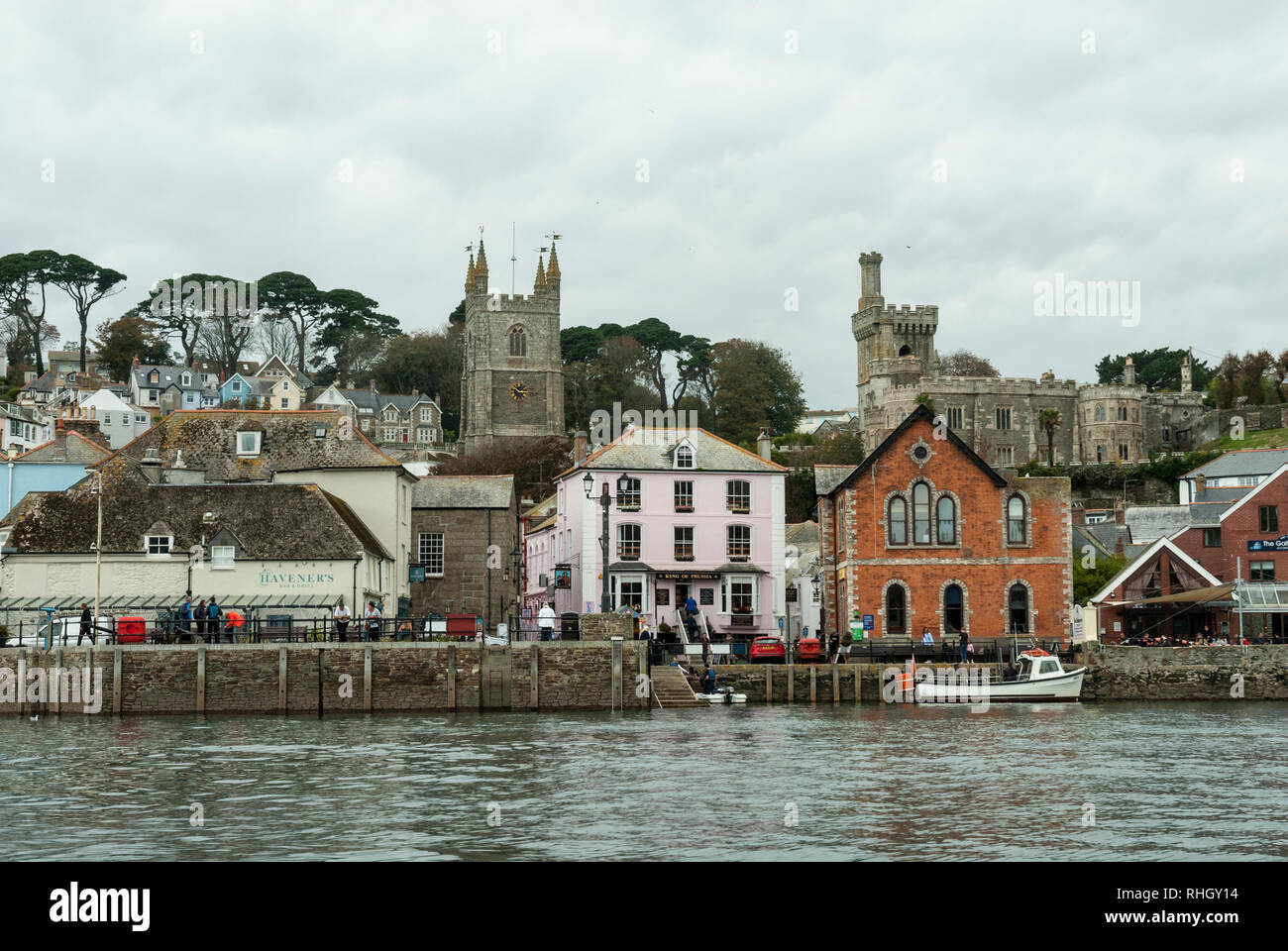 A view of Fowey, Cornwall from the sea showing historic seafront ...