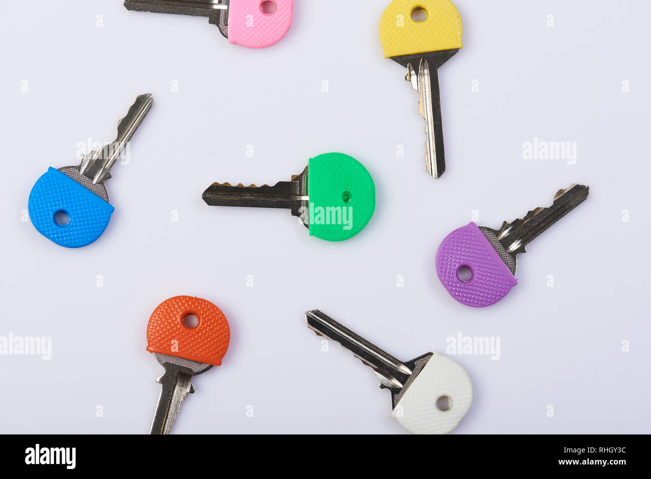 Metal colorful key background. Set of keys isolated on white Stock ...